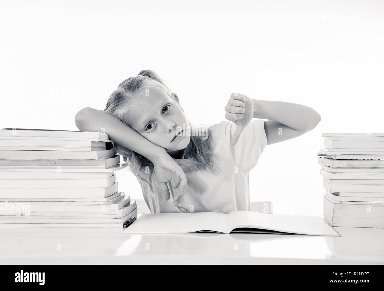 Beautiful school girl trying to study having too many homework that It ...