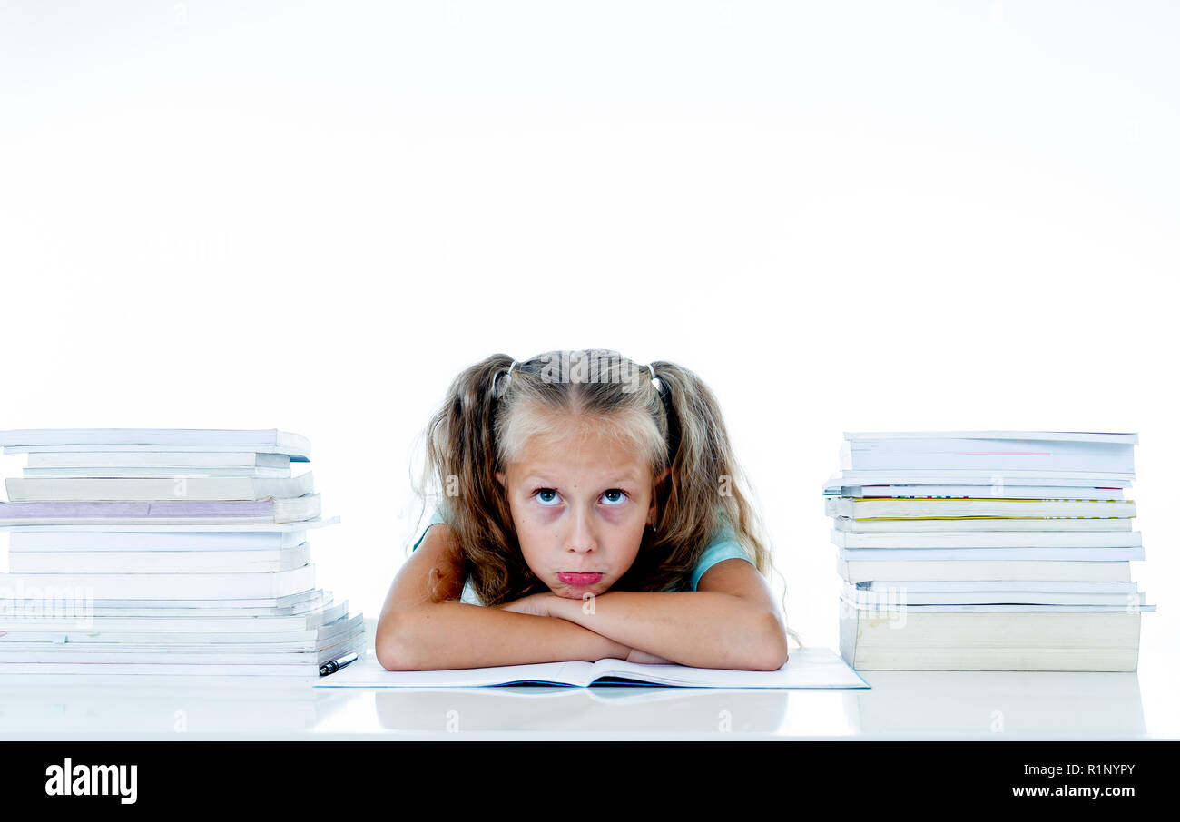 Frustrated little schoolgirl feeling a failure unable to concentrate in ...