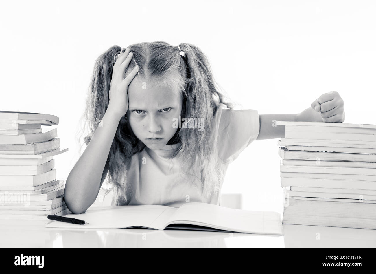 Angry little girl with a negative attitude towards studies and school ...