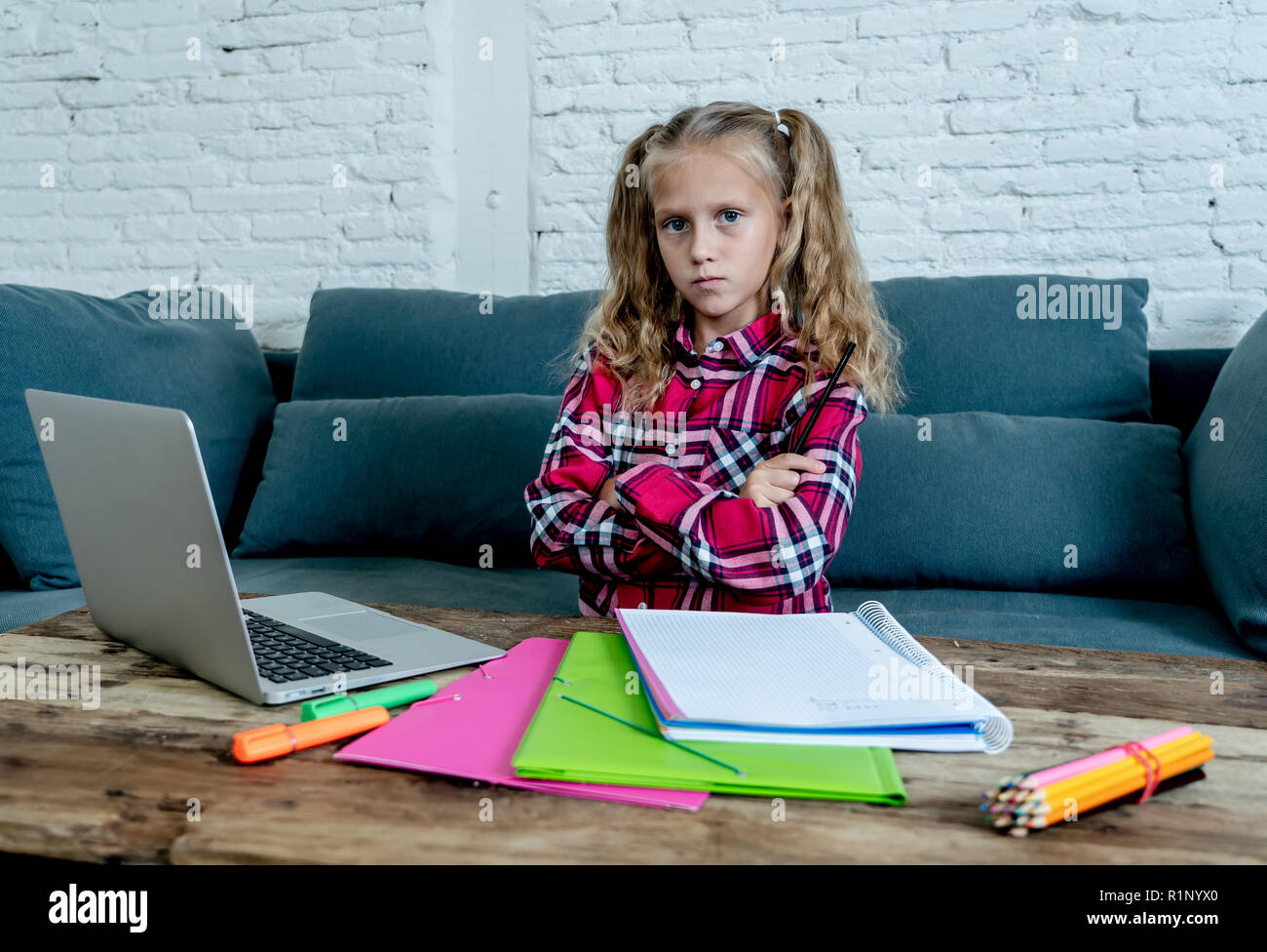 Cute sweet sad and overwhelmed blonde hair primary school girl looking ...
