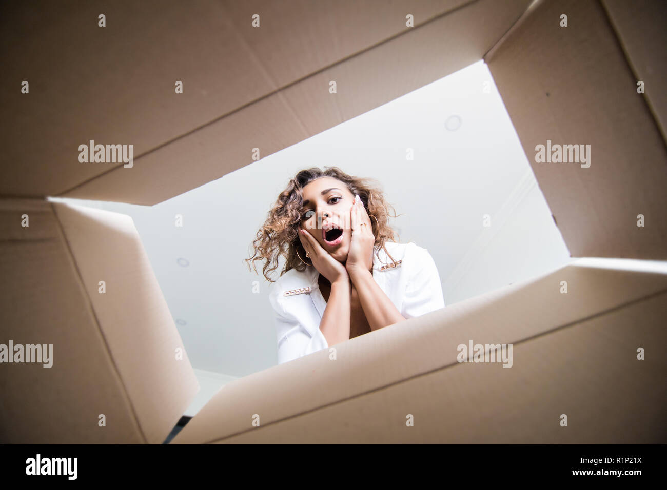Woman and opening box and scream hi-res stock photography and images ...