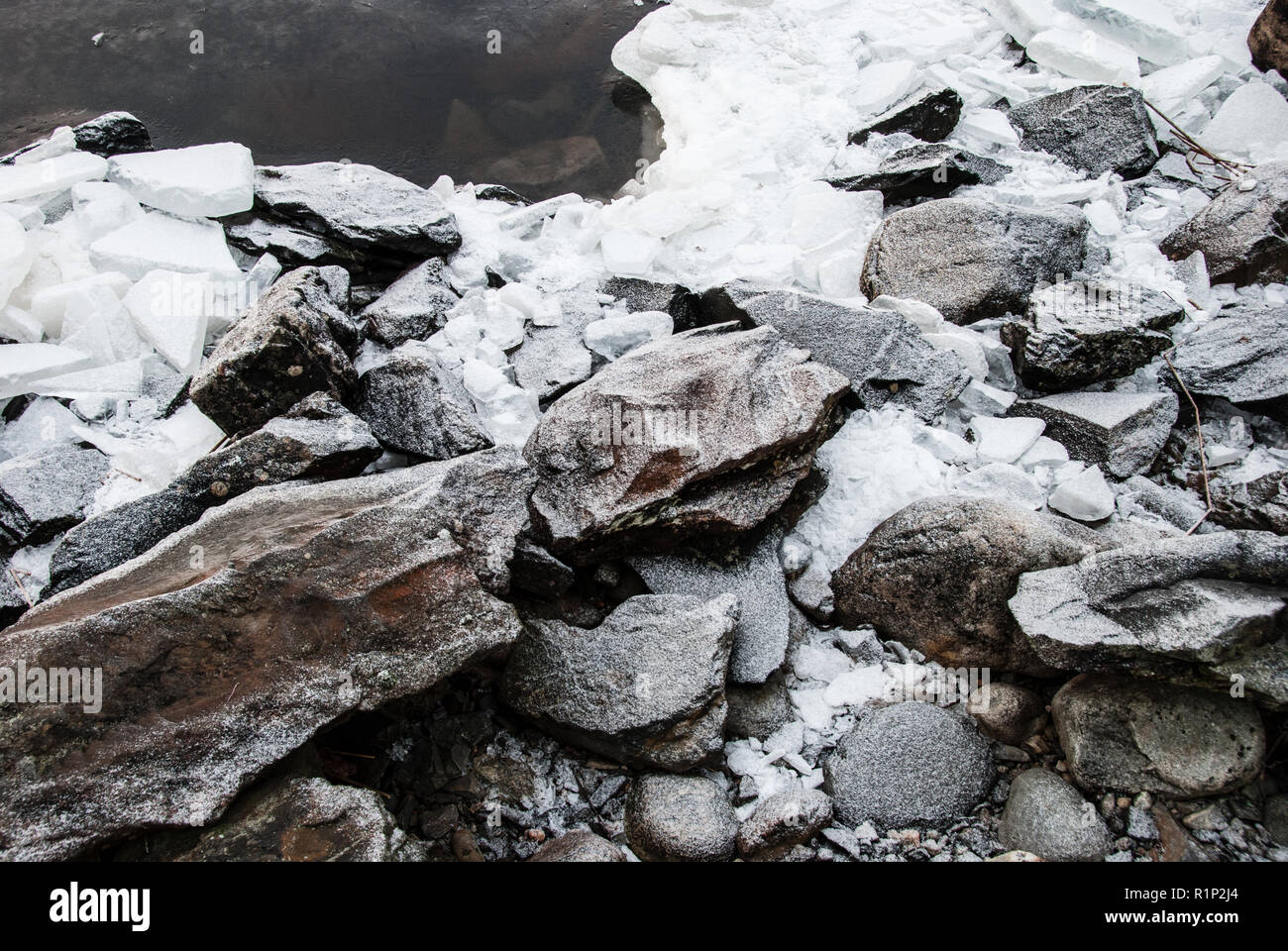 Ice and rocks on the beach Stock Photo - Alamy