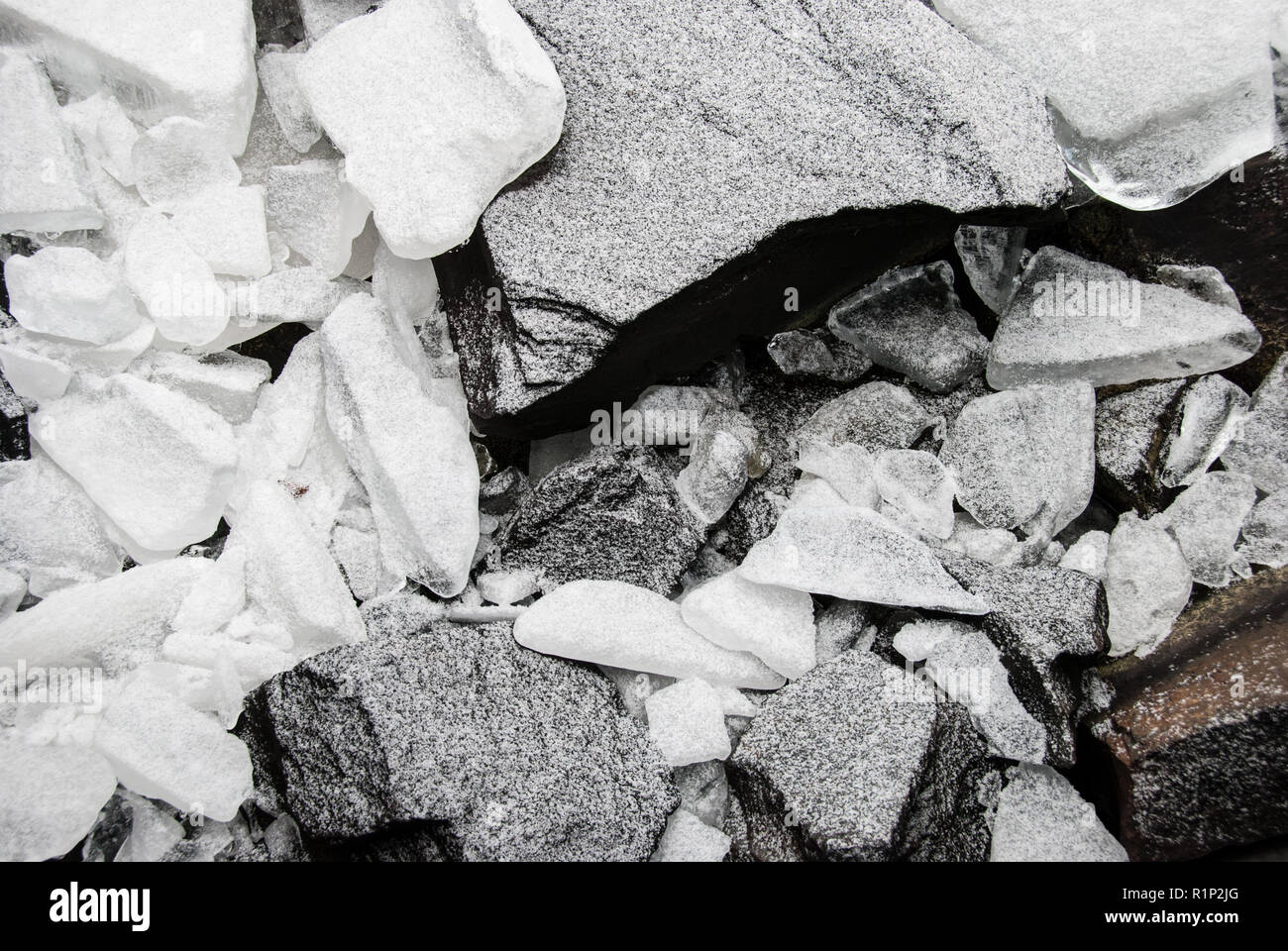Ice and rocks on the beach Stock Photo - Alamy