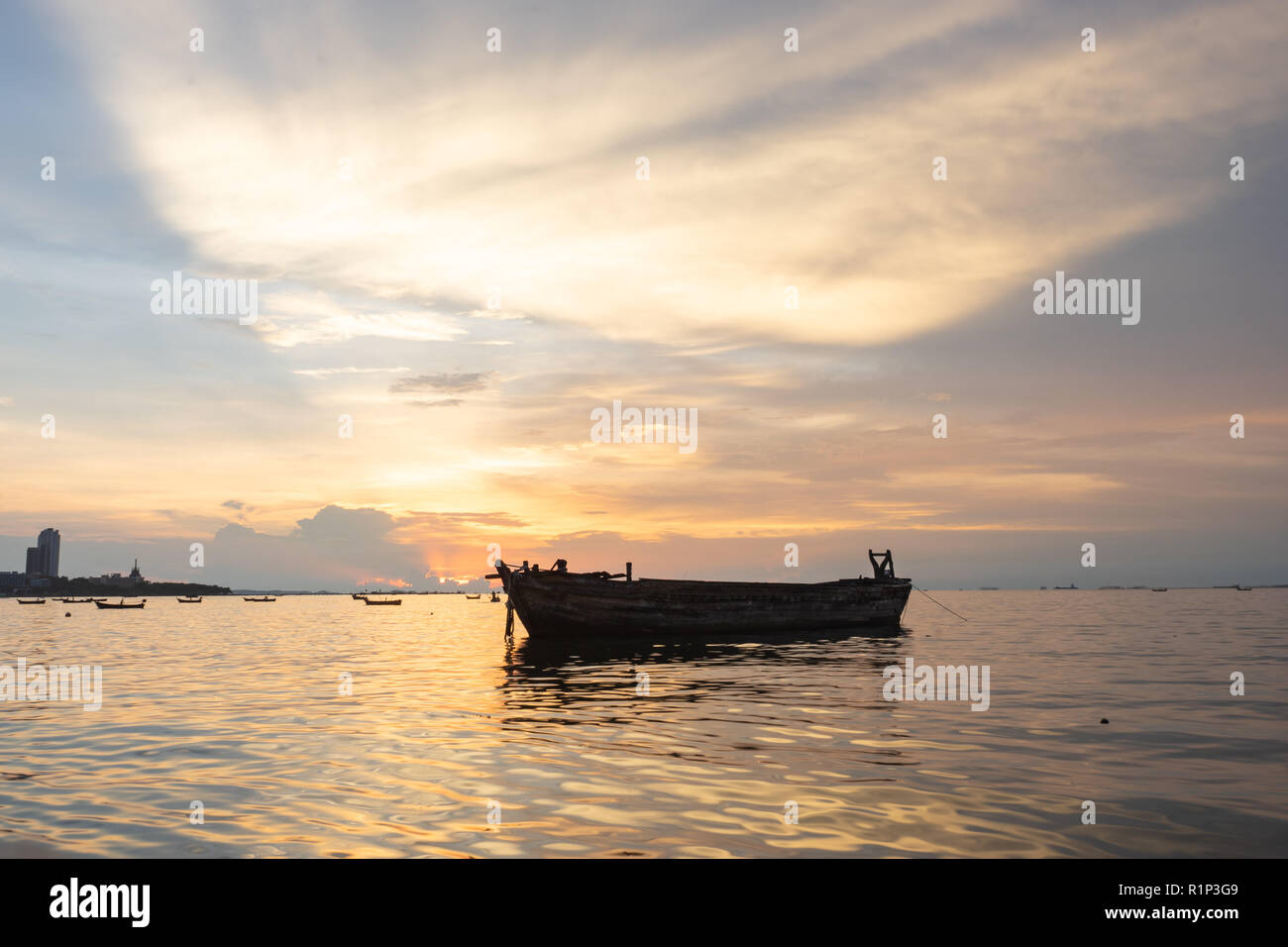 Boat in the ocean. Sunset scene Stock Photo - Alamy