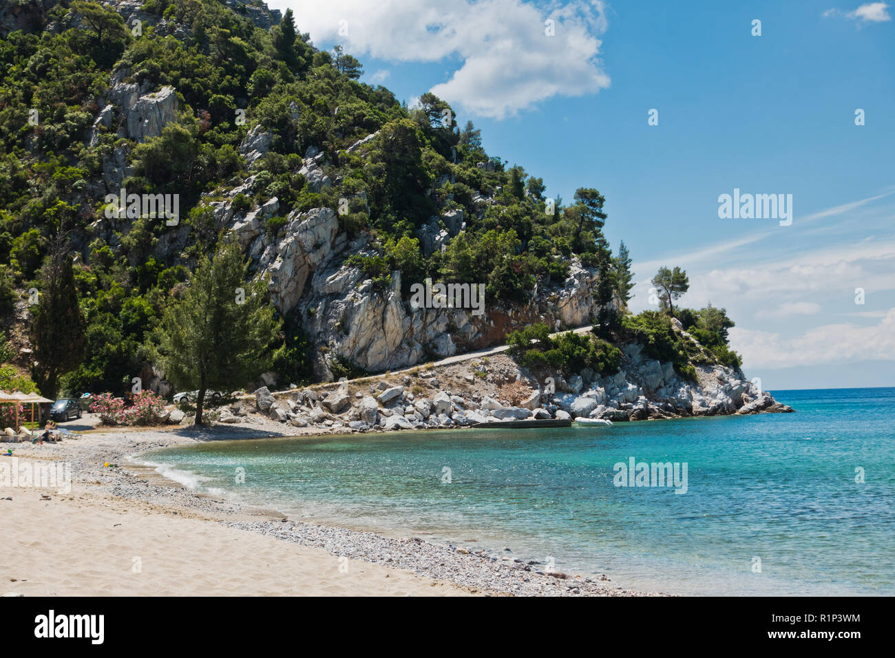 Beach and coastal road at Limnonari, sunny morning at Skopelos island ...