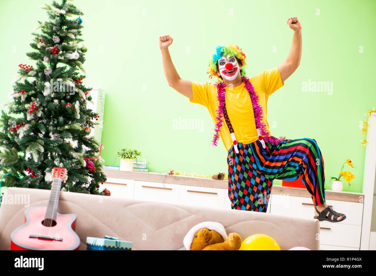 Funny clown in Christmas celebration concept Stock Photo - Alamy