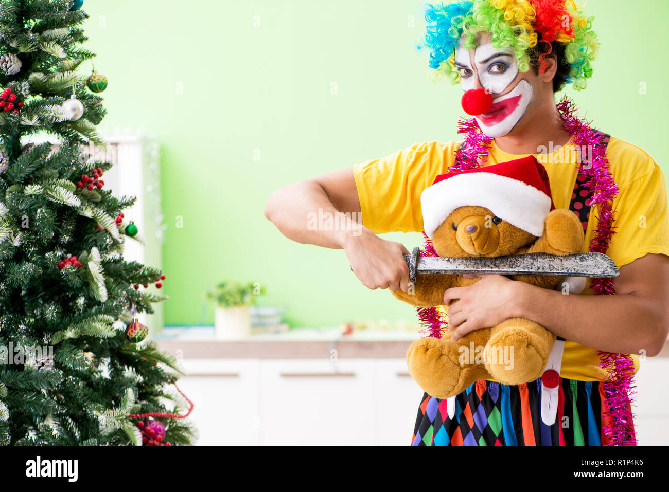 Funny clown in Christmas celebration concept Stock Photo - Alamy