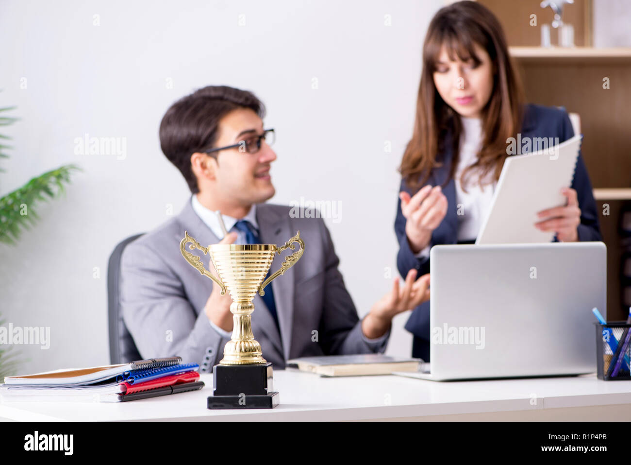 Concept of teamwork with prize Stock Photo - Alamy