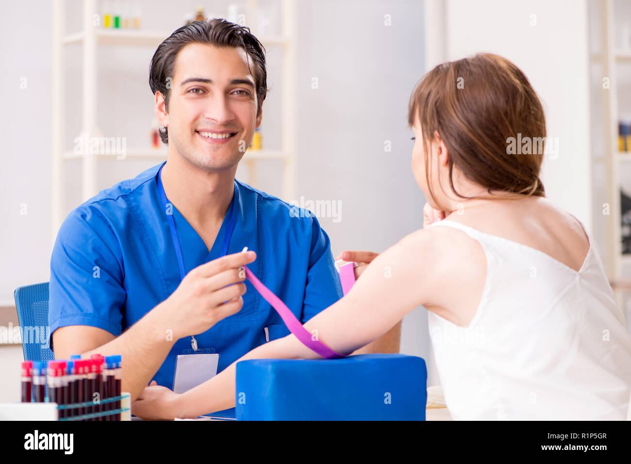 Young patient during blood test sampling procedure Stock Photo - Alamy