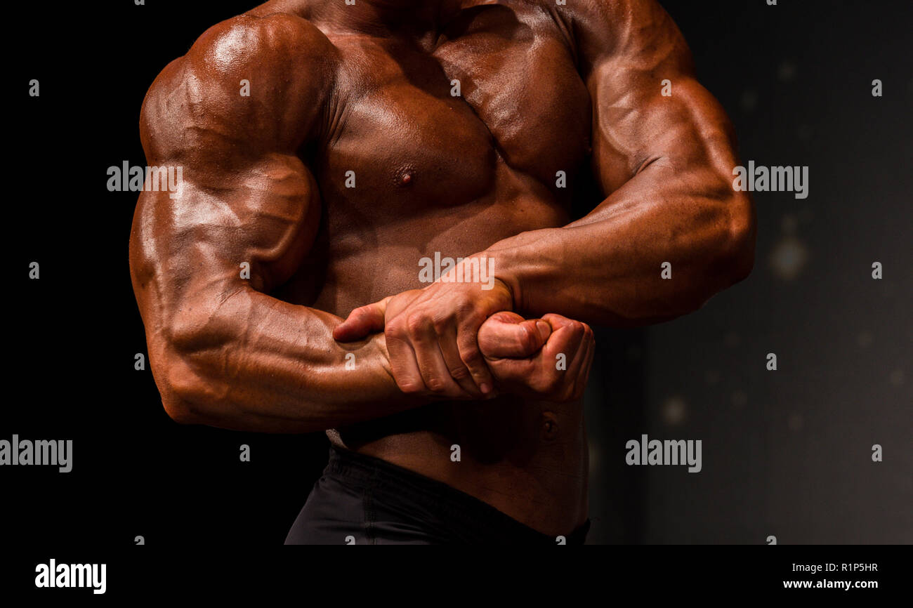 Close-up of a power fitness man's hand. Strong and handsome bodybuilder ...