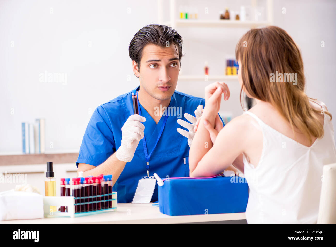 Young patient during blood test sampling procedure Stock Photo - Alamy