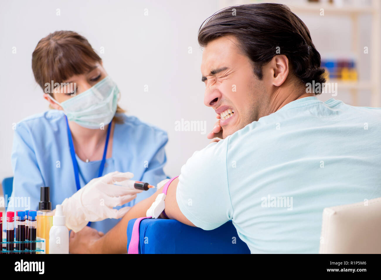 Young patient during blood test sampling procedure Stock Photo - Alamy