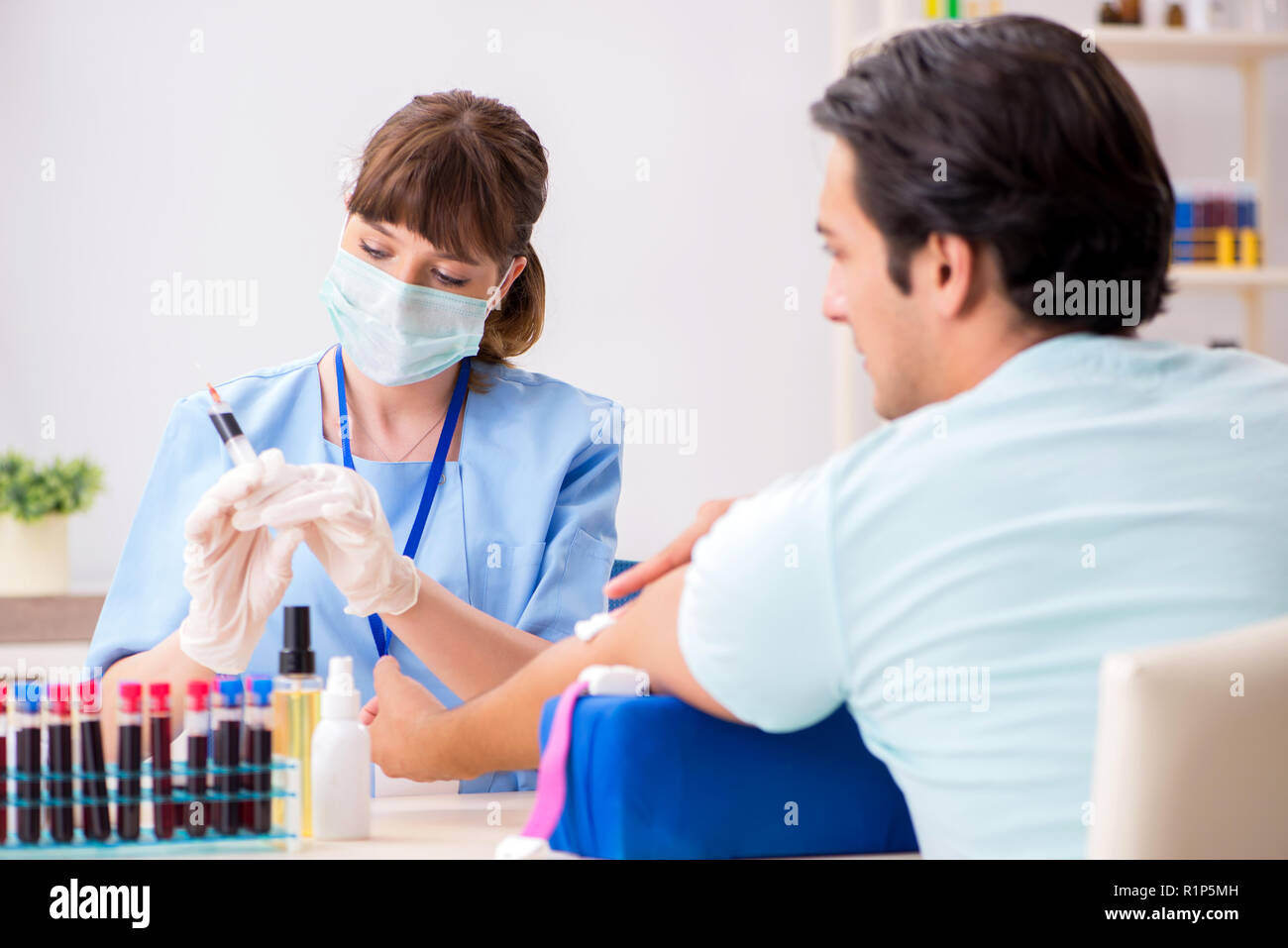 Young patient during blood test sampling procedure Stock Photo - Alamy