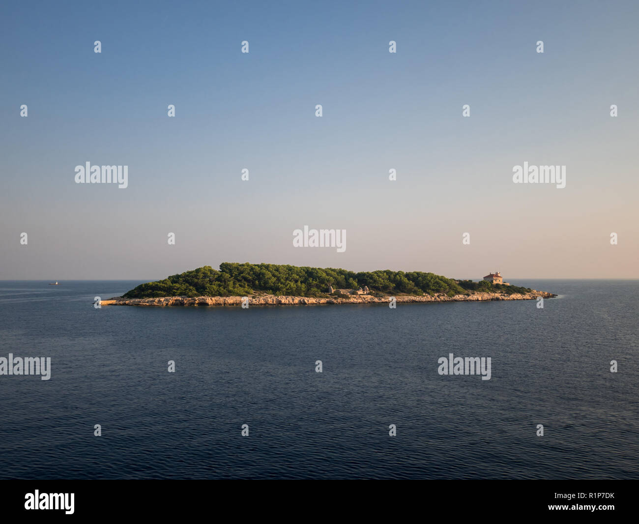 Small island Host on Adriatic sea in Croatia at sunrise Stock Photo - Alamy