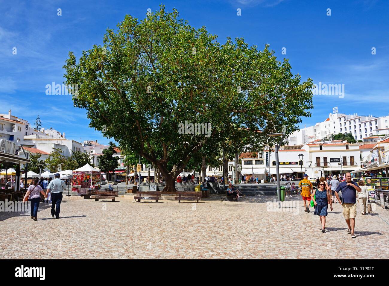 View of the main square in the old town with tourists enjoying the ...
