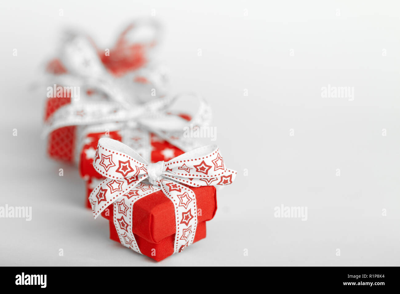 Red Christmas gift boxes on white background Stock Photo - Alamy