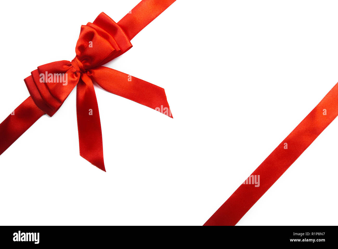 Shiny red satin ribbon on white background Stock Photo - Alamy
