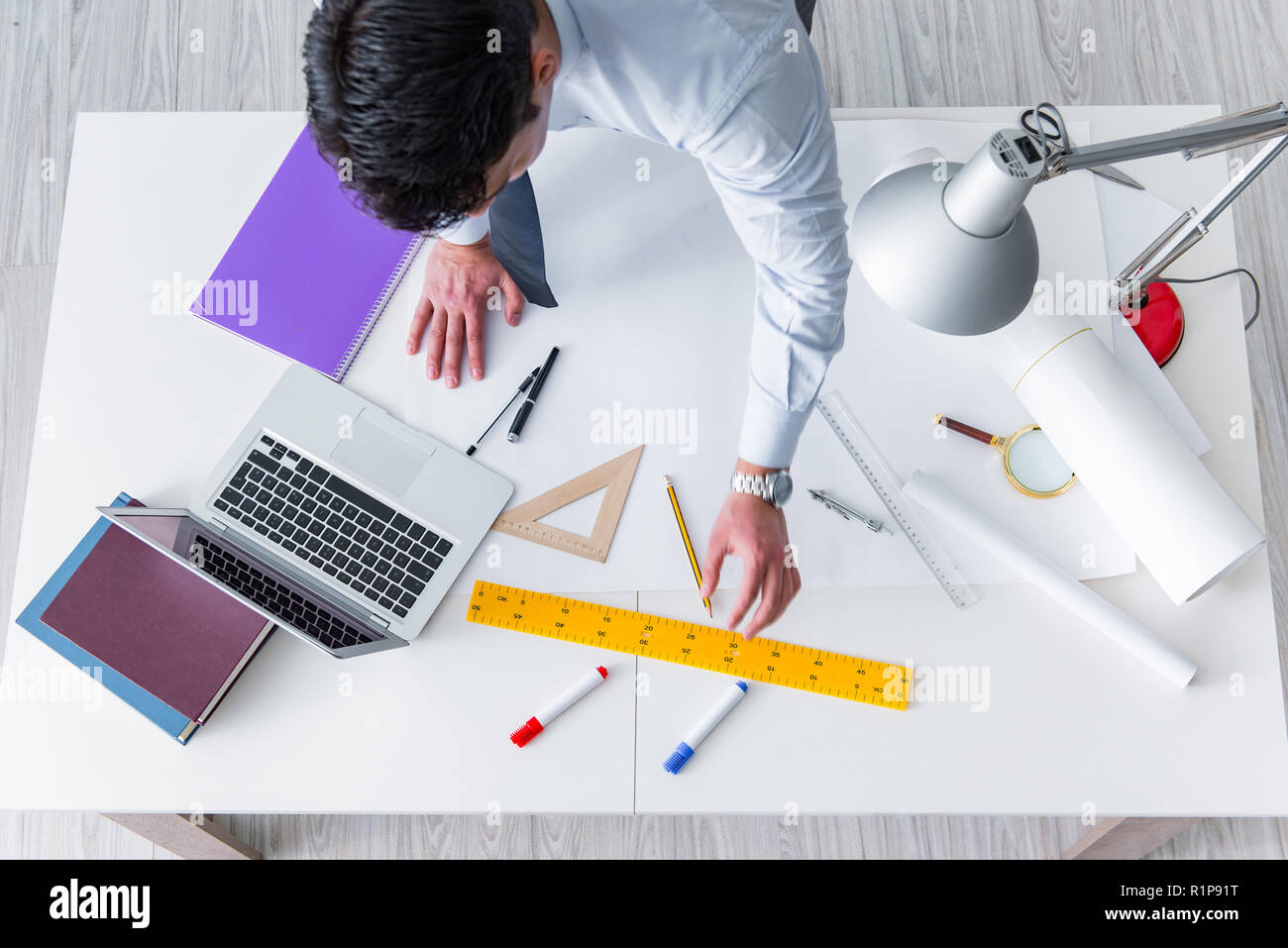 Engineer working on new project drawings Stock Photo - Alamy