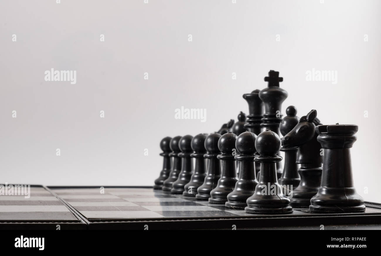 Black chess side view on a black background 2018 Stock Photo - Alamy