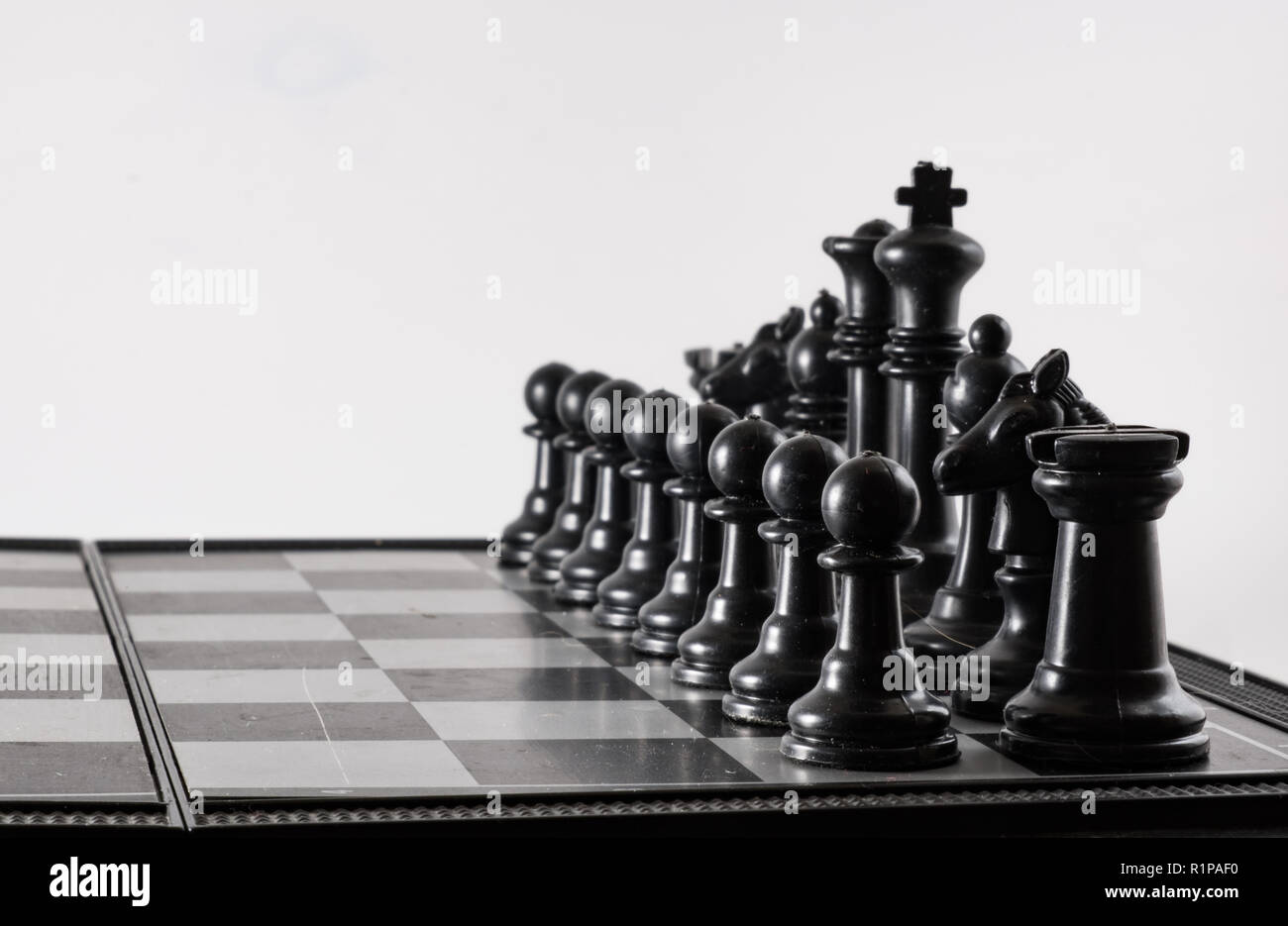 Black chess side view on a black background 2018 Stock Photo - Alamy