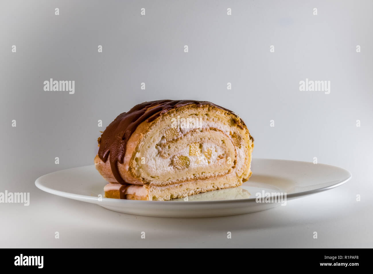 Handmade rolls on a white plate on a white background 2 Stock Photo - Alamy
