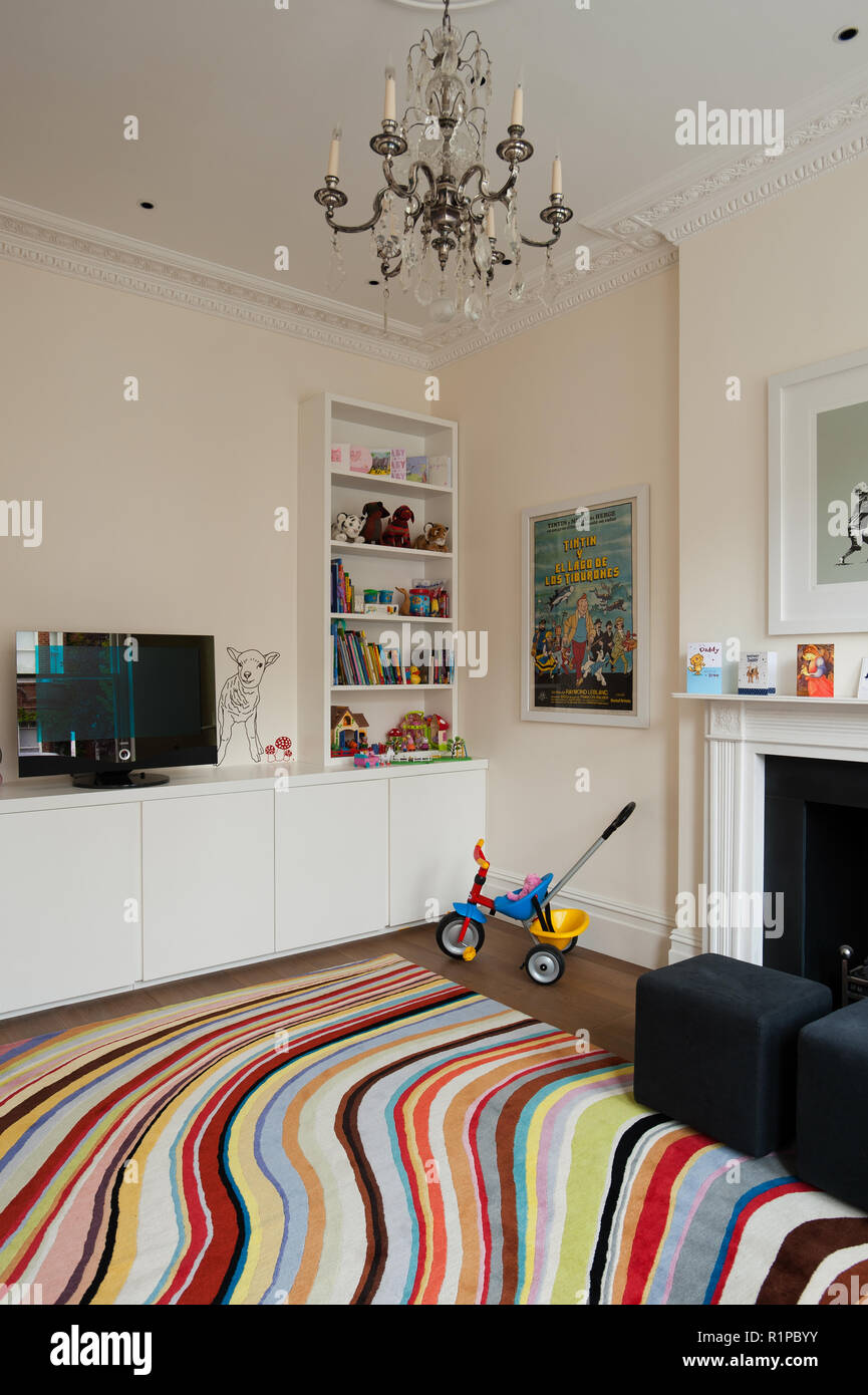 Colorful rug in modern living room Stock Photo - Alamy