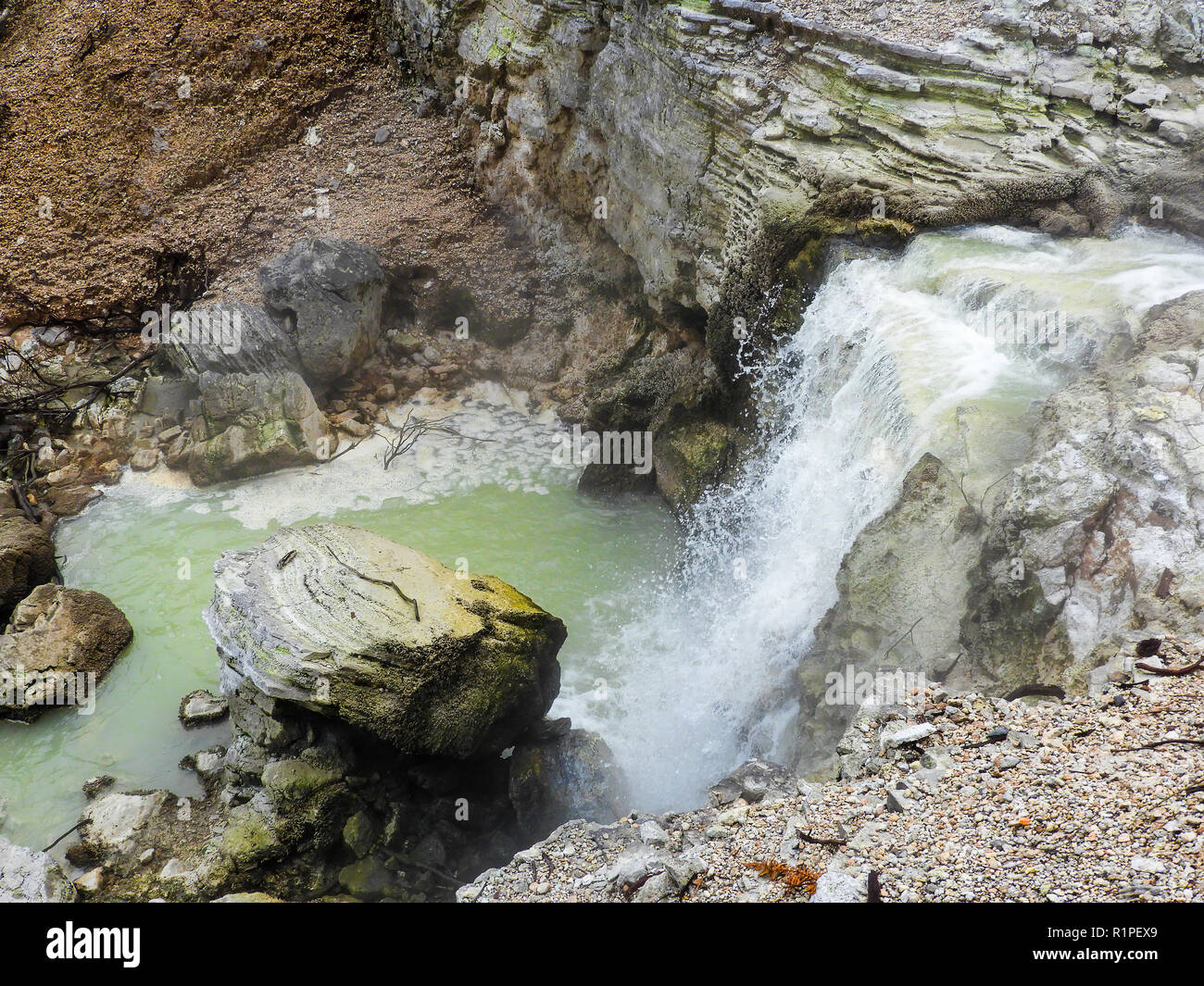 Lake Ngakoro Waterfall, Wai-o-Tapu geothermal park, New Zealand. White ...