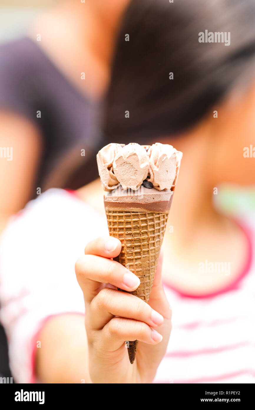 ice cream in young girl hand Stock Photo - Alamy