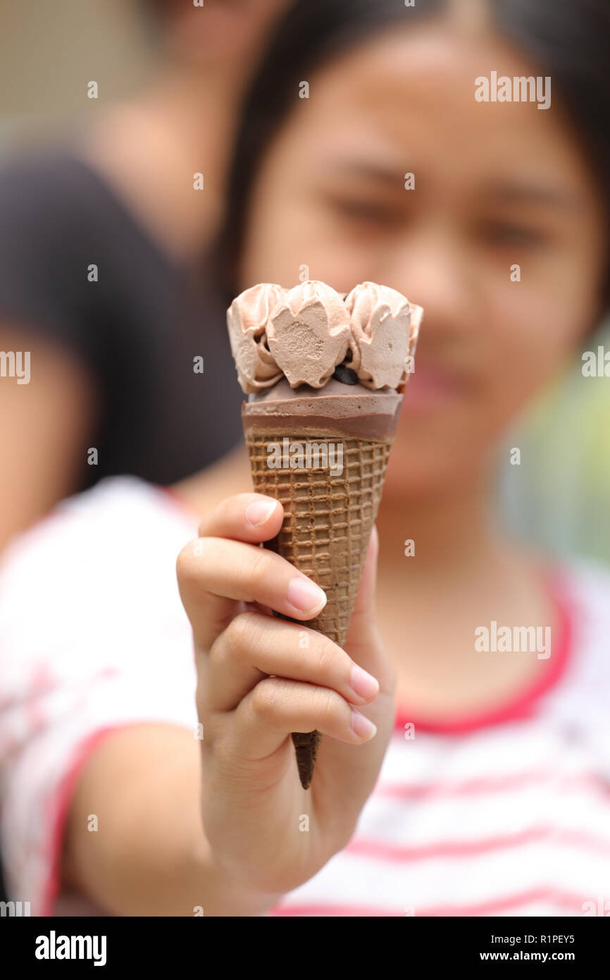 ice cream in young girl hand Stock Photo - Alamy