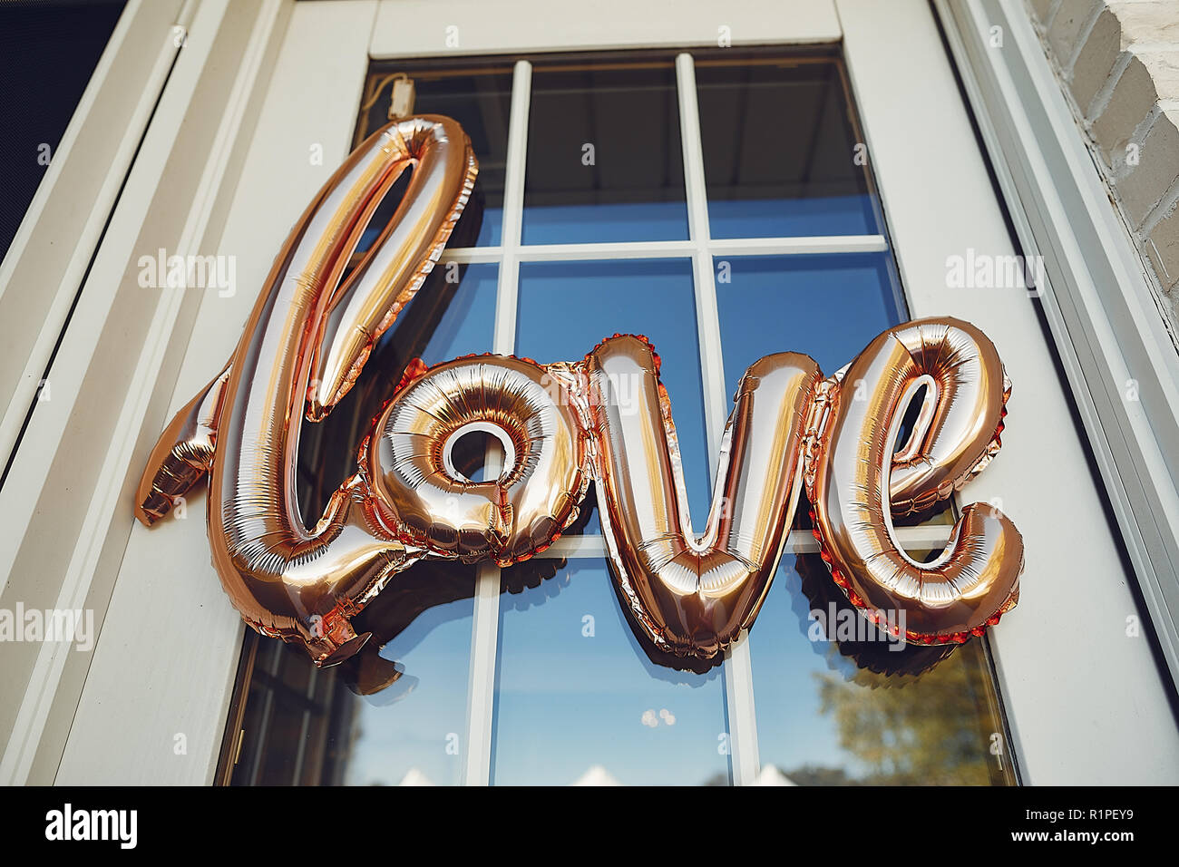 Gold foil letter balloon hi-res stock photography and images - Alamy