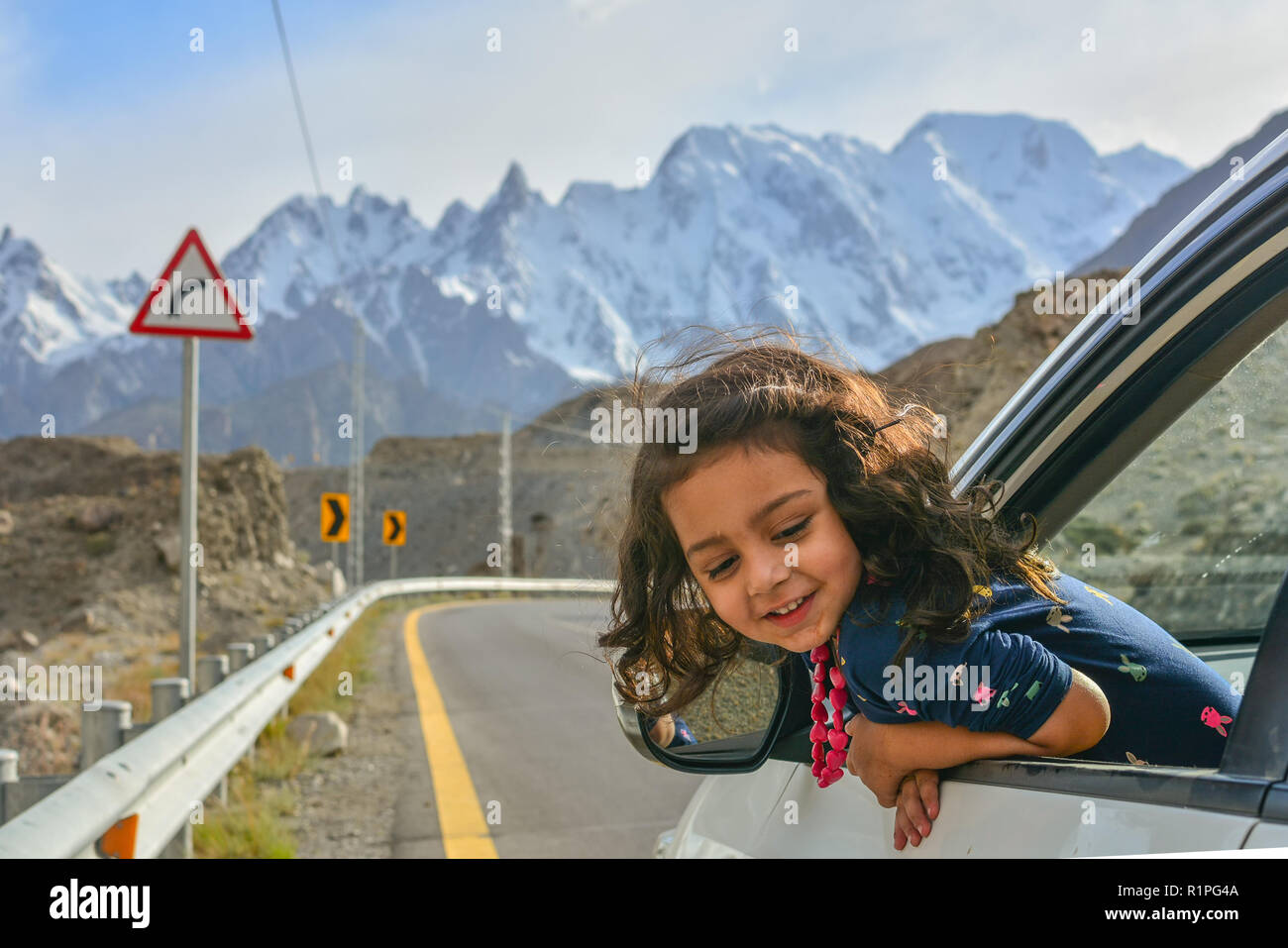 A happy girl with face out of the window Stock Photo - Alamy