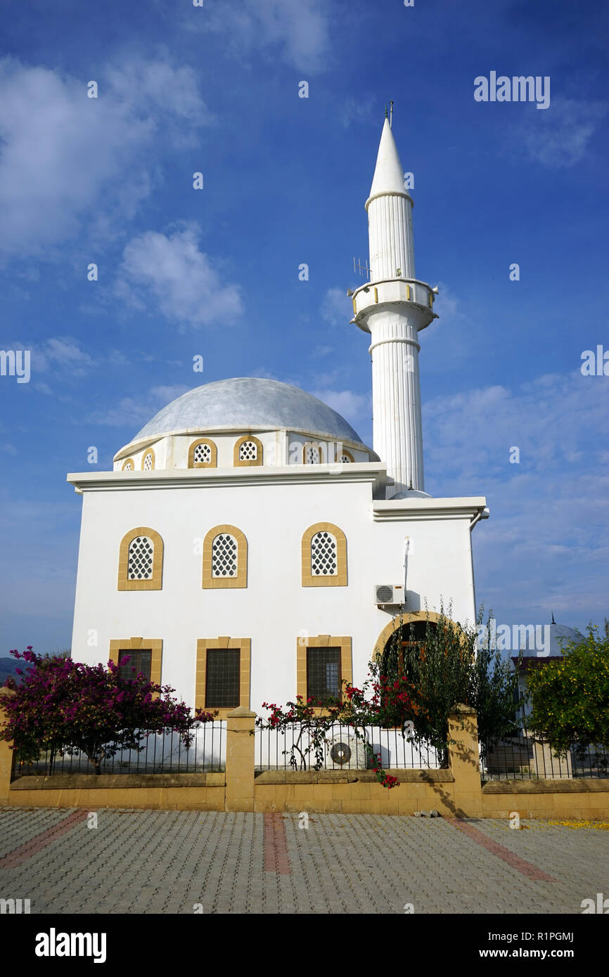 GIRNE, NORTH CYPRUS - CIRCA OCTOBER 2018 White mosque with minaret ...