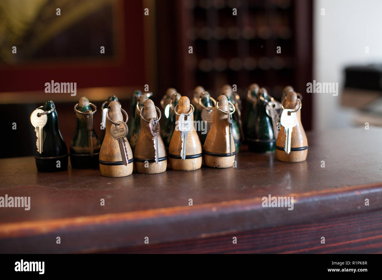 hotel keys. Keys lying on the hotel counter. Brown keys with a wooden ...