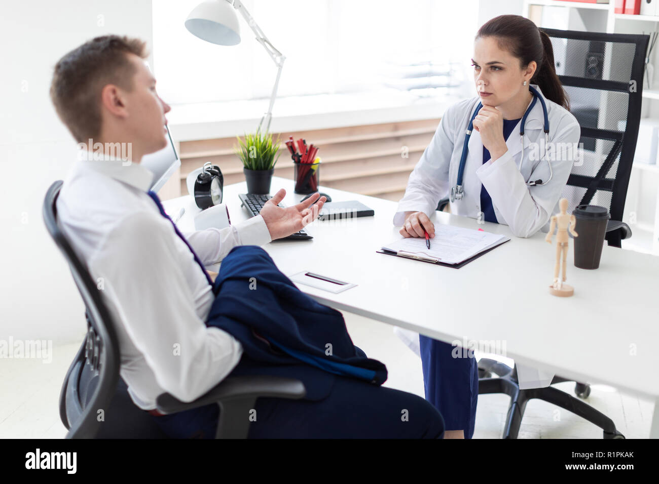 The young man came to see the doctor Stock Photo - Alamy