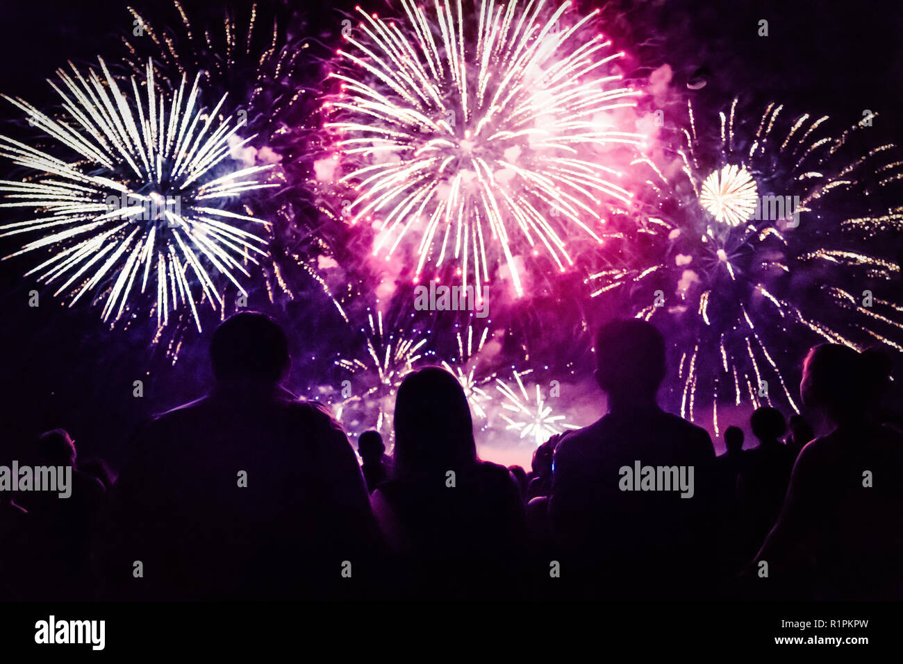 New year concept - cheering crowd and fireworks Stock Photo - Alamy