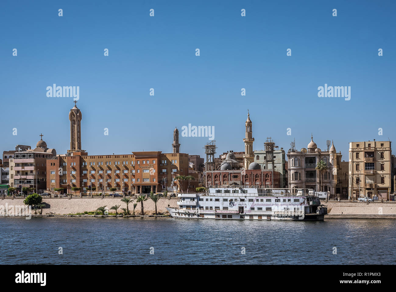 A cruise ship is by the dock at Esna, a little egyptian town with ...