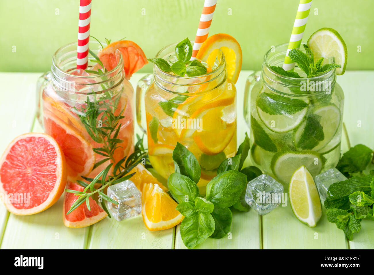 Selection of infused water for detox, wood background Stock Photo - Alamy
