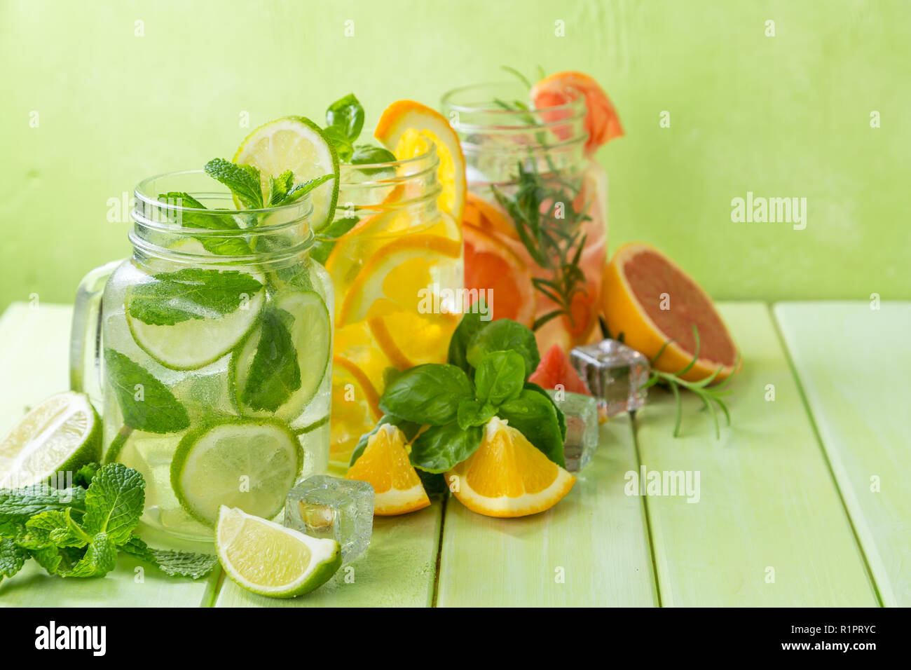 Selection of infused water for detox, wood background Stock Photo - Alamy