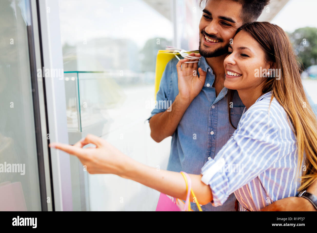Happy attractive loving couple enjoy shopping together Stock Photo - Alamy