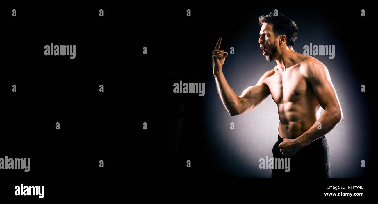 Strong athletic muscular man feeling victory and enjoys success in ...