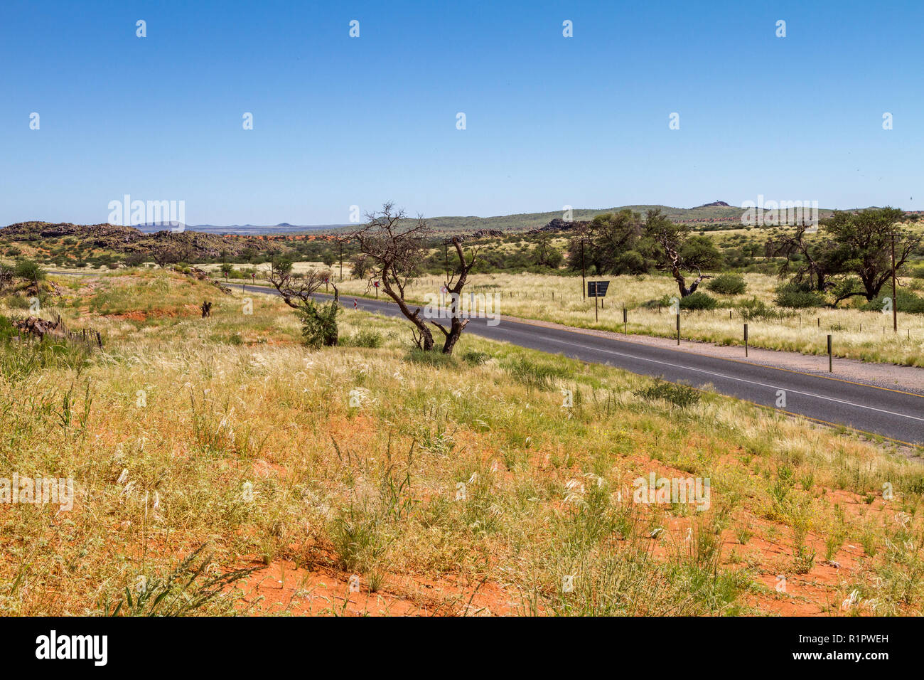 Driving through the arid landscape of the Northern Cape province of ...