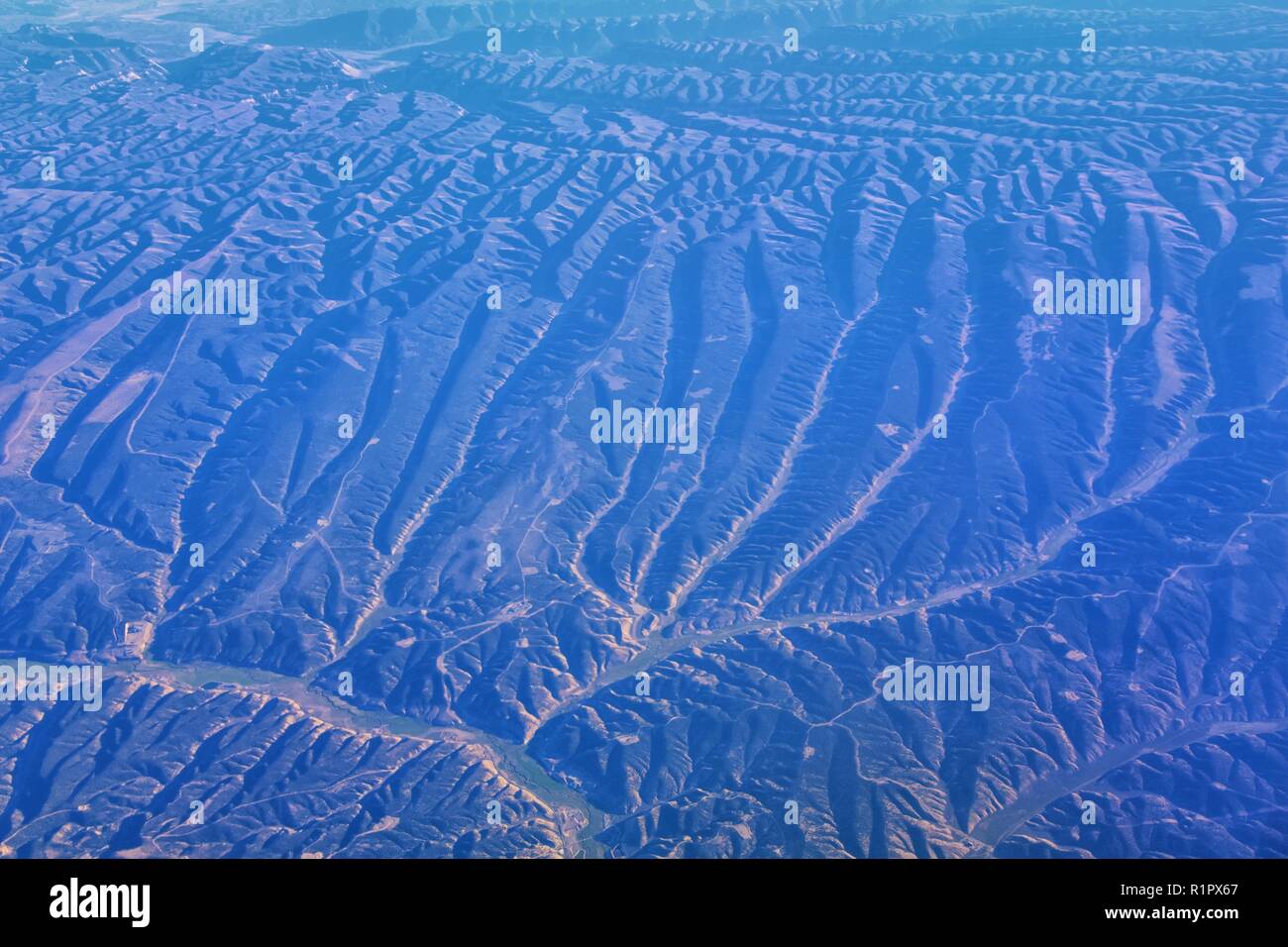 Aerial view of topographical Rocky Mountain landscapes on flight over ...