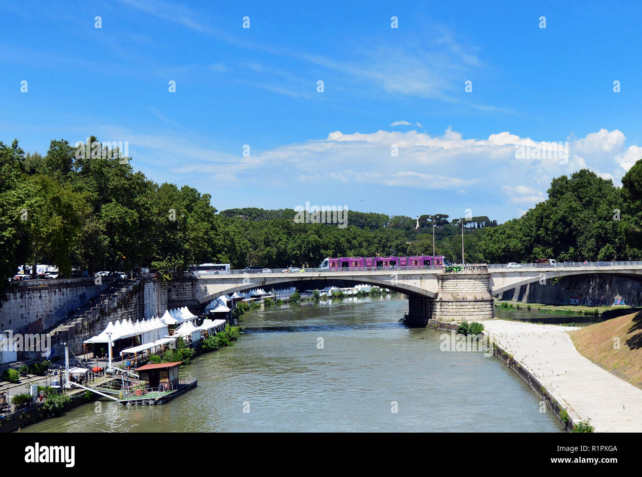 Garibaldi bridge with a tram over the Tiber river in Rome Stock Photo ...