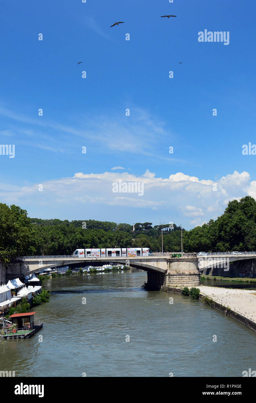 Garibaldi bridge with a tram over the Tiber river in Rome Stock Photo ...