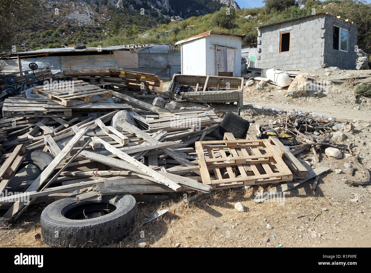 A pile of building materials near the warehouse Stock Photo - Alamy