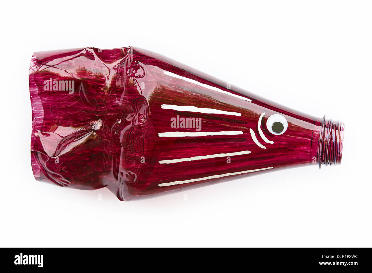Plastic bottle recycled in a fish figure. Reuse garbage. Isolated Stock ...
