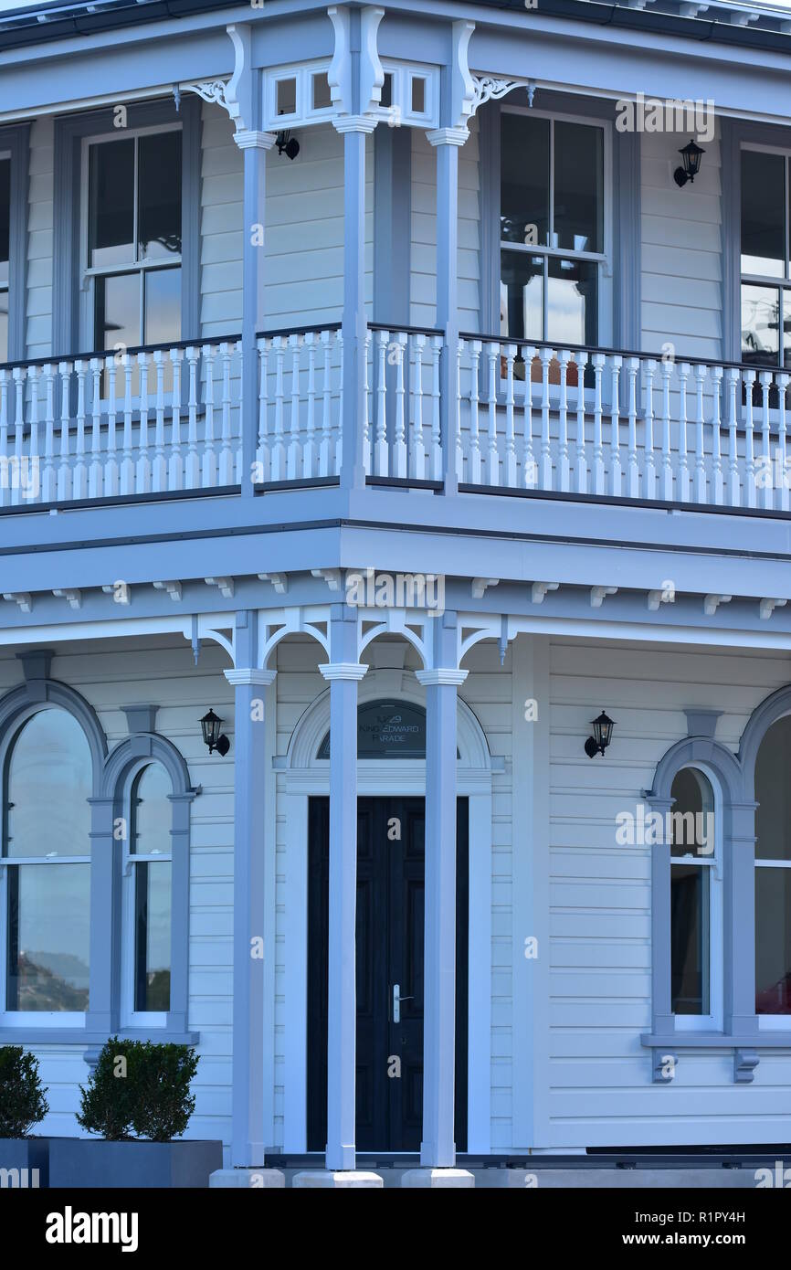 Vertical view of two floor classic wooden townhouse with high ceilings ...