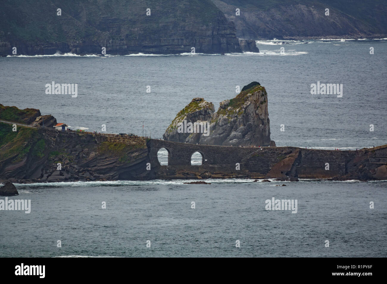 San Juan de Gaztelugatxe islet access bridge profile Stock Photo - Alamy