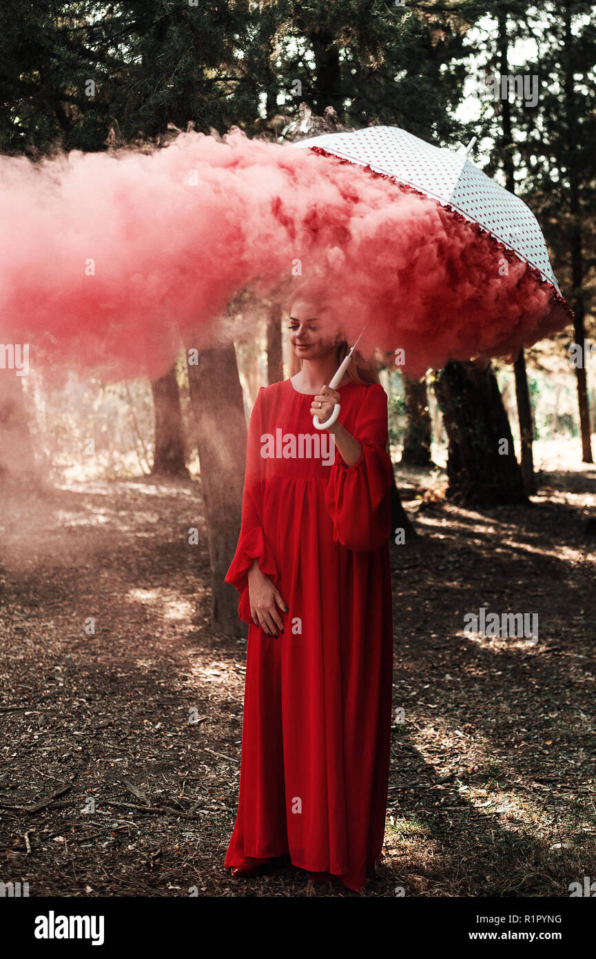 Girl Blowing Colorful Smoke