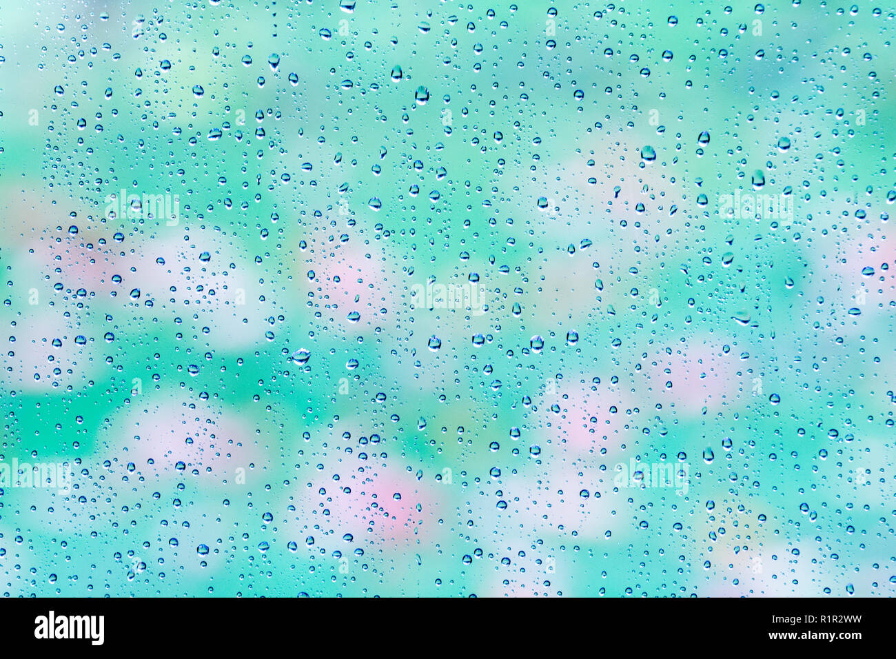 Water drop abstract background over bright colours Stock Photo - Alamy